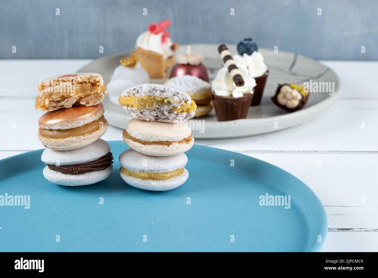 Stack of macarons filled with chocolate ganache, dulce de leche and ...