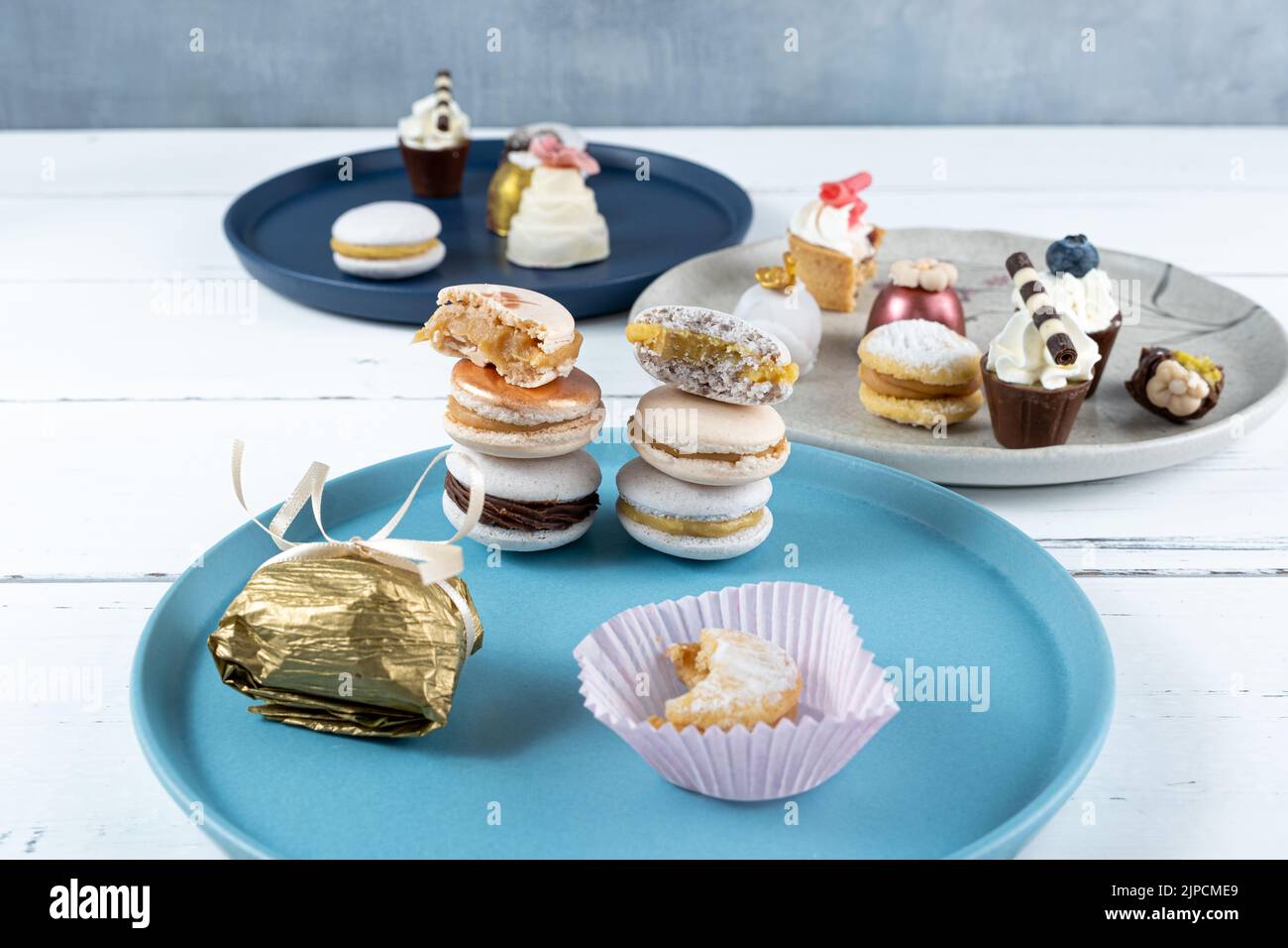 Stacked macarons surrounded by Wedding sweet treats, truffles and ...