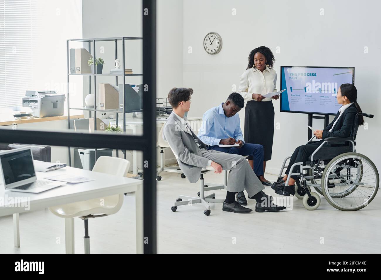 Business people cooperating and working in team during presentation at ...