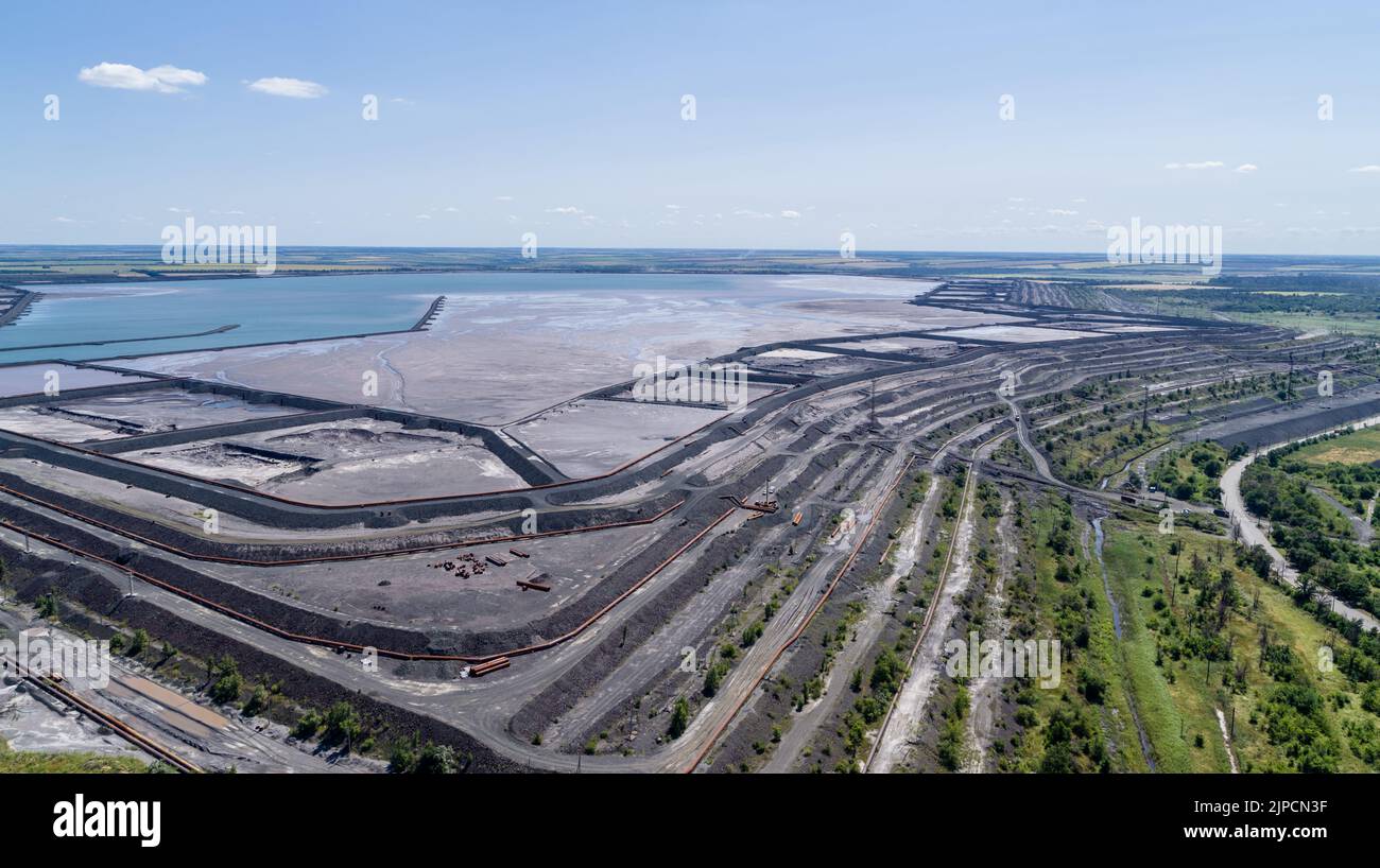 Tailing dump in industrial city aerial view Stock Photo - Alamy