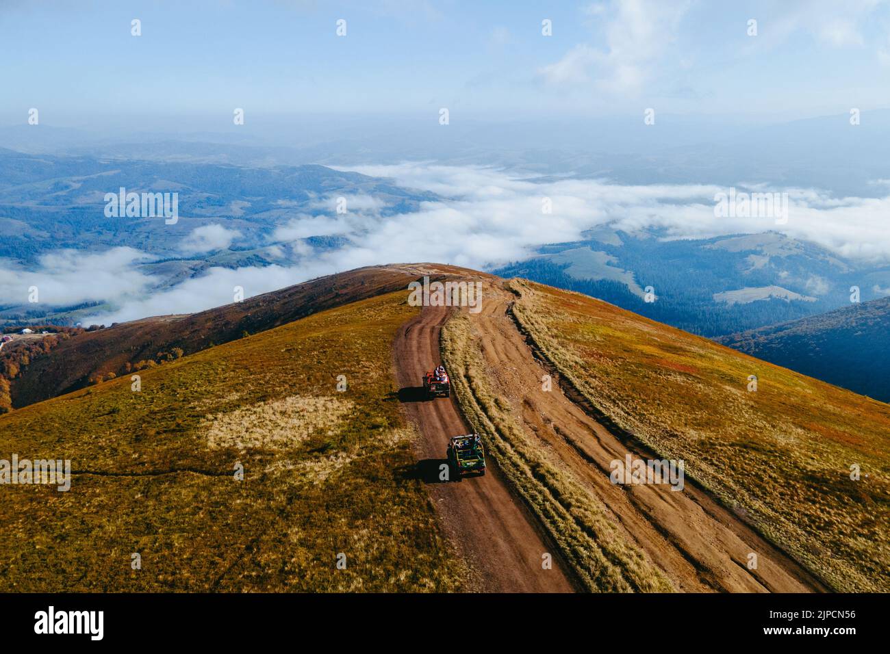 aerial view of suv off road travel climbing up by mountain hill Stock ...