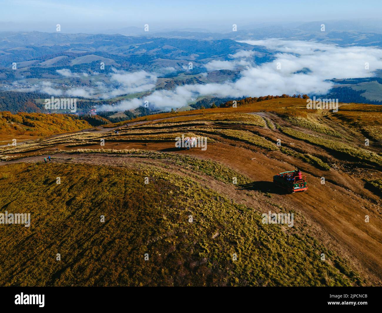 aerial view of suv off road travel climbing up by mountain hill Stock ...