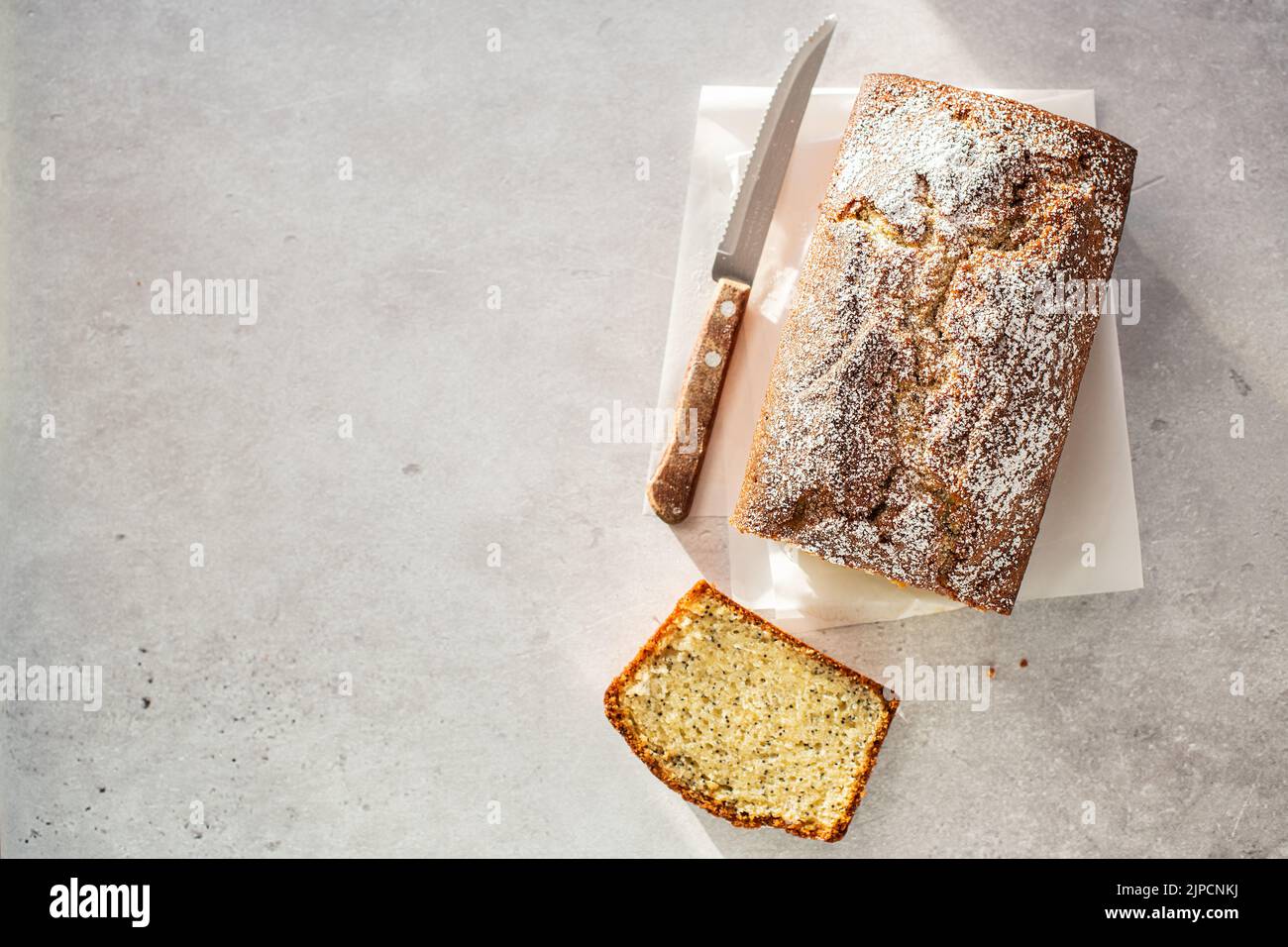 Sliced lemon cake with poppy seeds, top view Stock Photo - Alamy