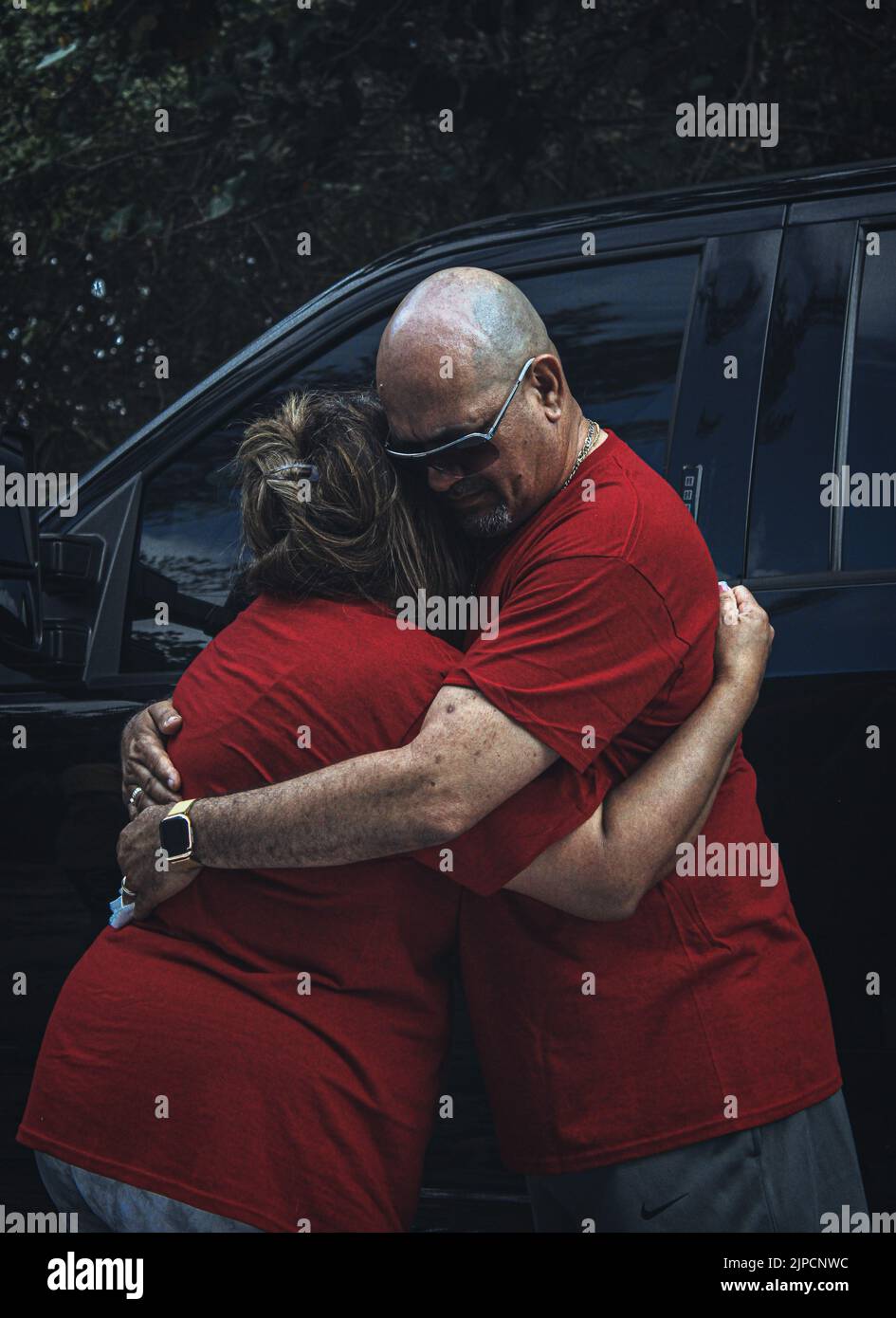 Male and female embracing one another to show care, compassion, and ...