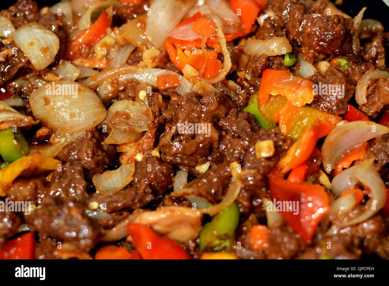Chinese food cuisine of grilled beef red meat pieces and cubes with oil ...