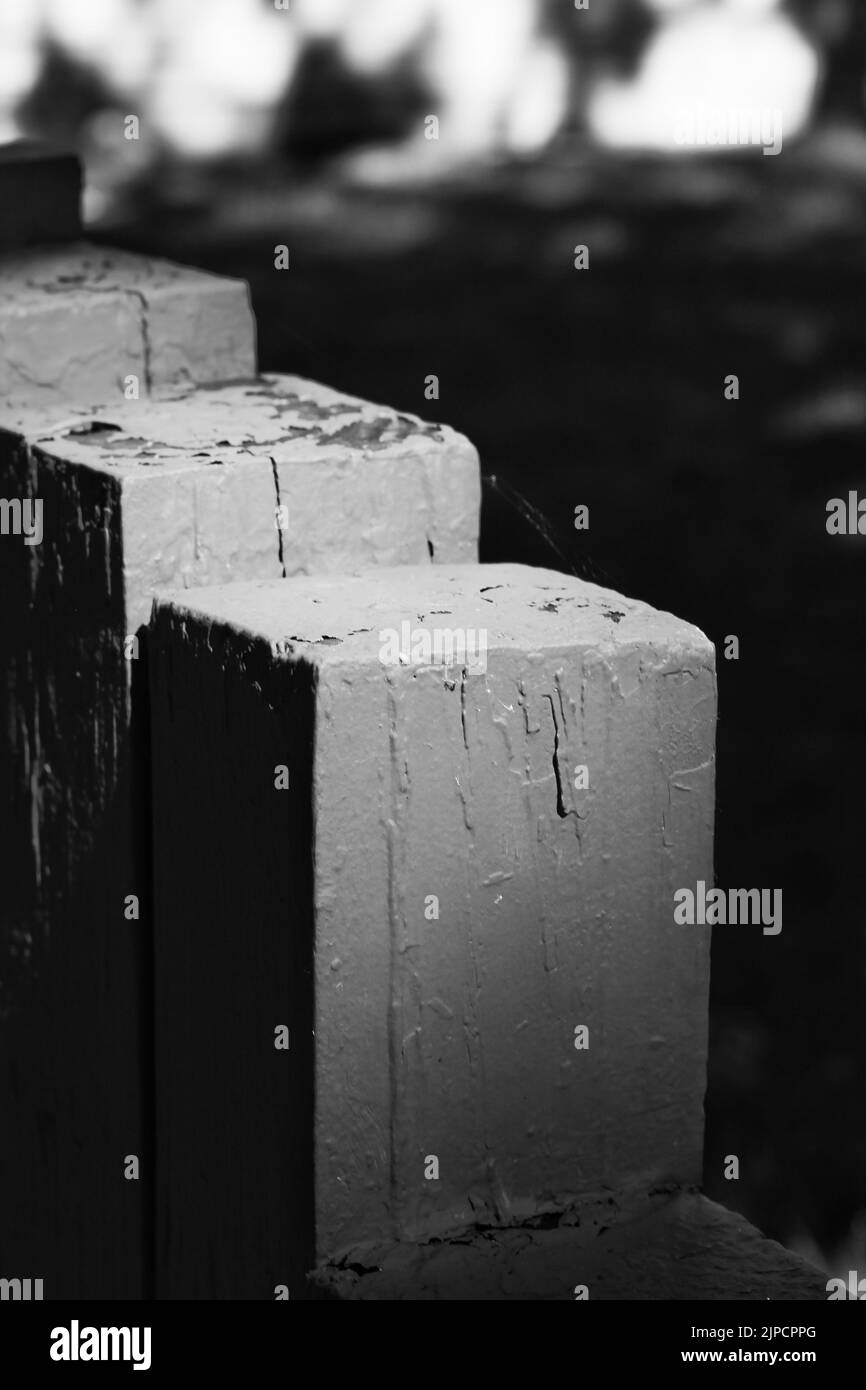 Closeup of outdoor wooden posts standing as a surface for an objec in ...