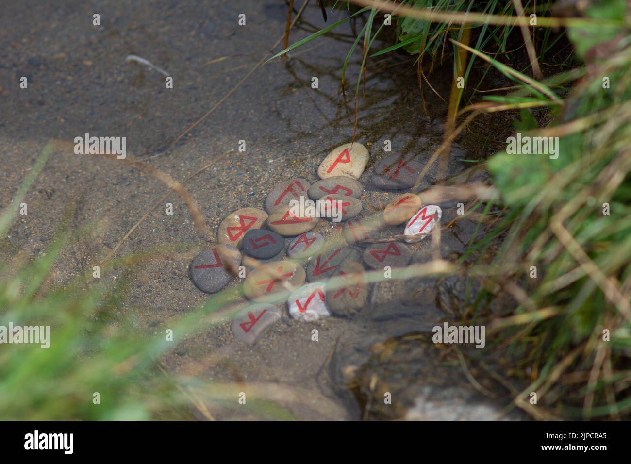 Underwater norther runes carved in rocks Stock Photo - Alamy