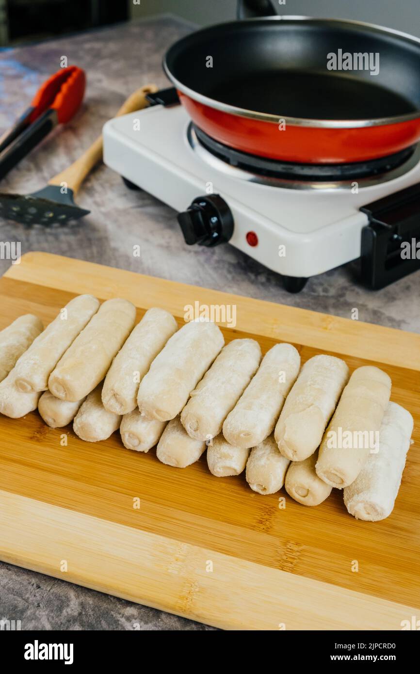 Raw tequeños ready to cook, typical Venezuelan snack at parties Stock ...