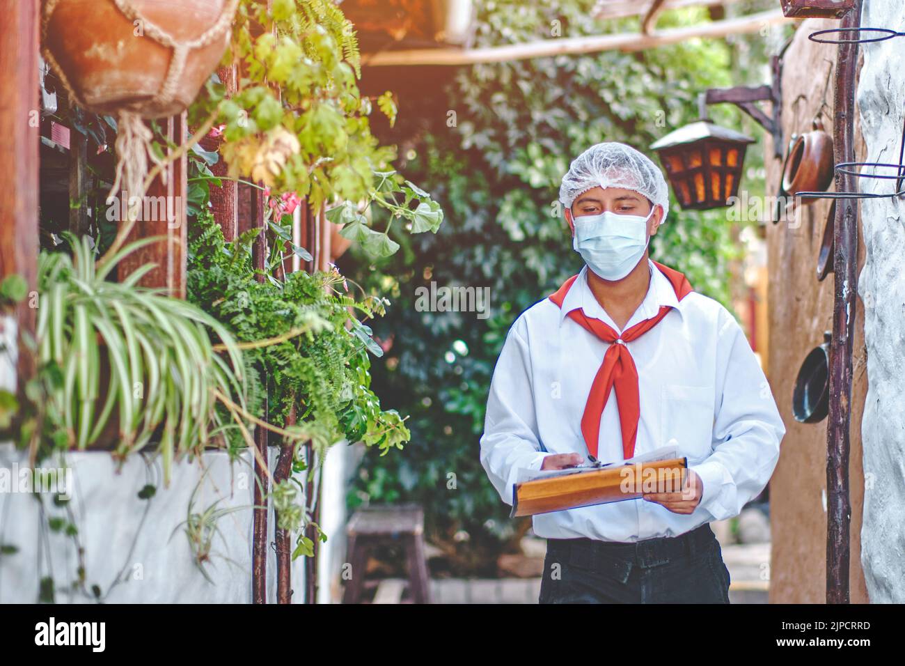 waiter with traditional uniform of peruvian restaurant, a traditonal ...