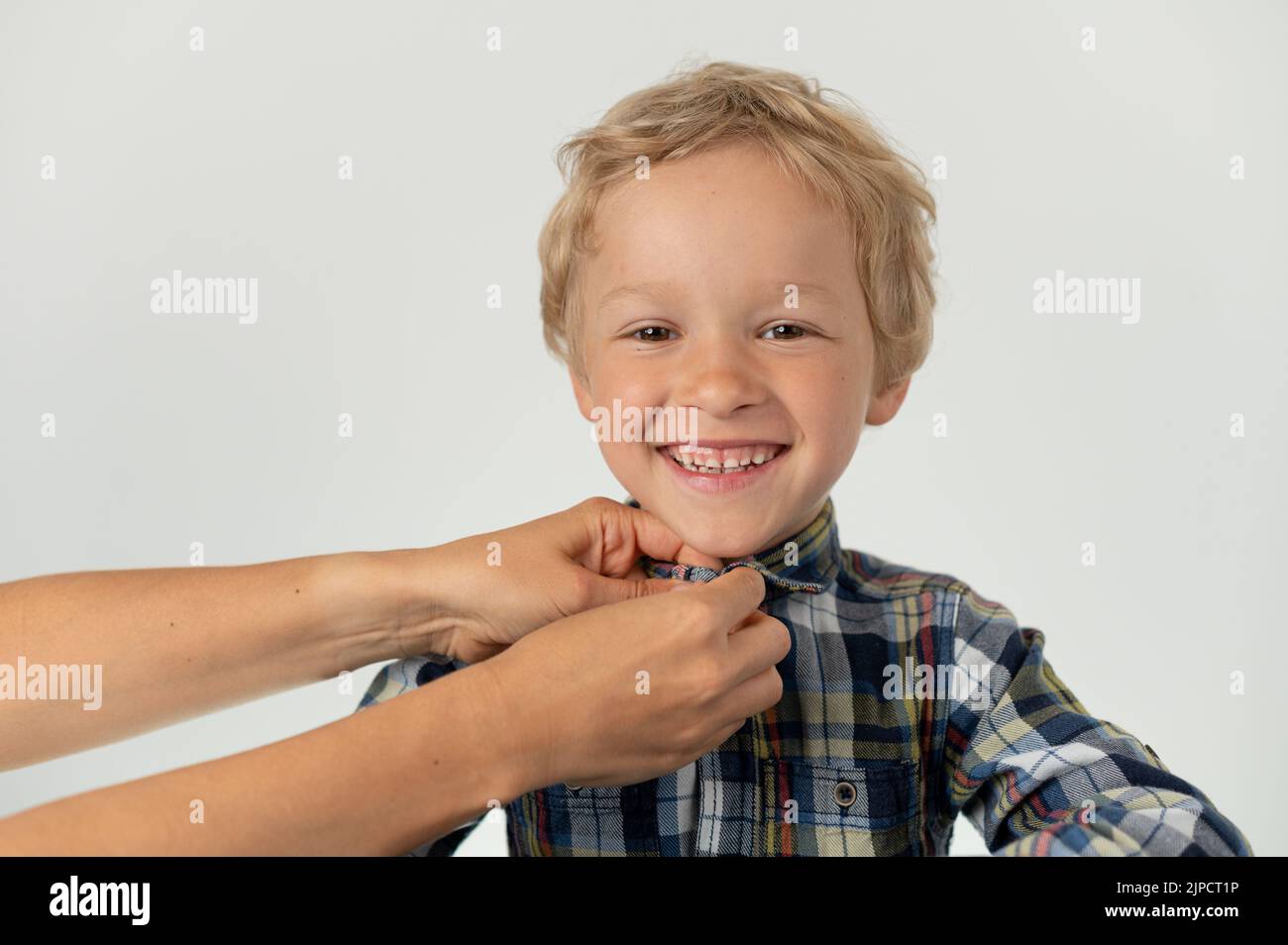 Boy deciding what cloth to put on Stock Photo - Alamy