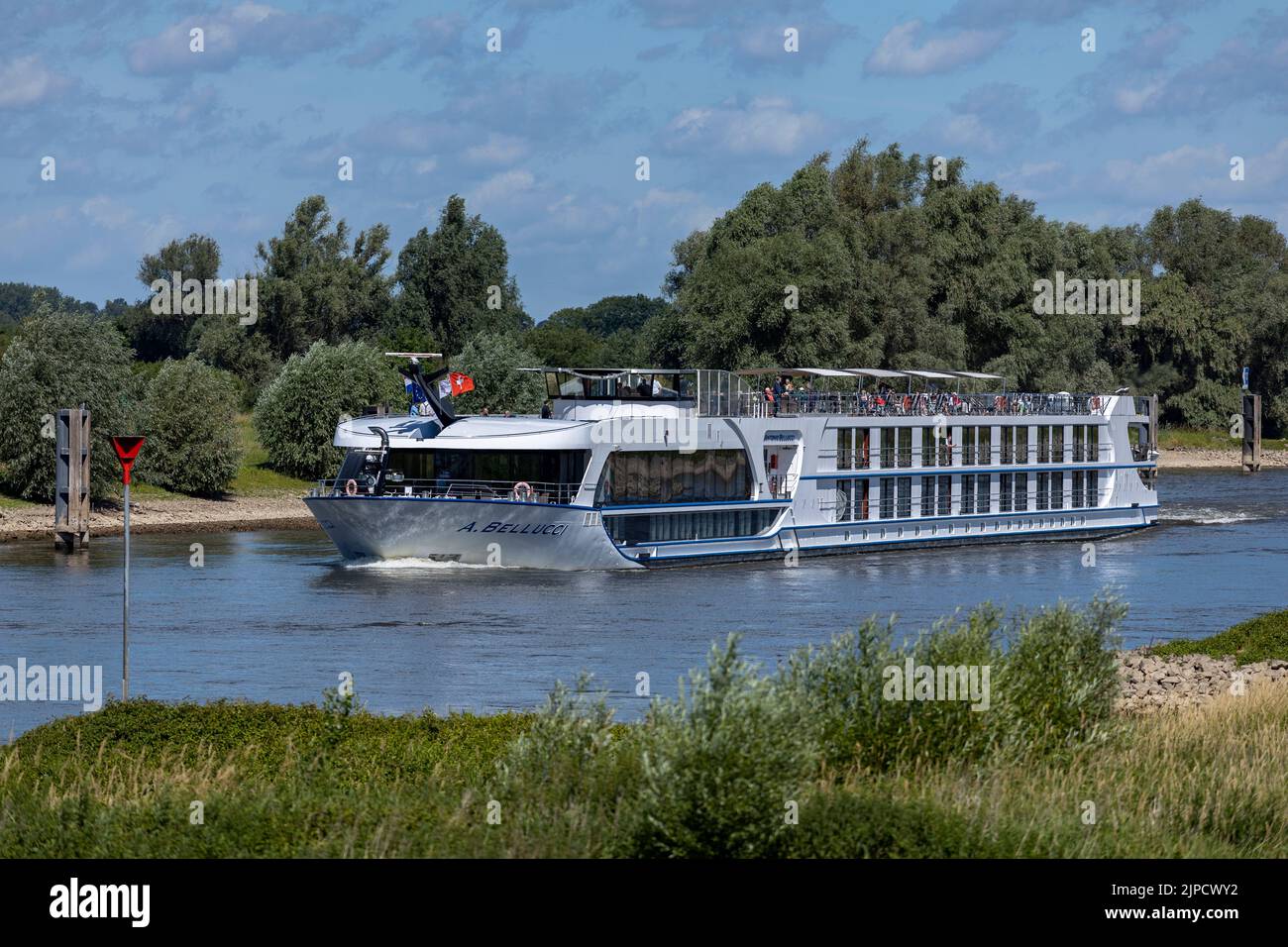 Large tourist passenger boat with people cruising on river IJssel with ...