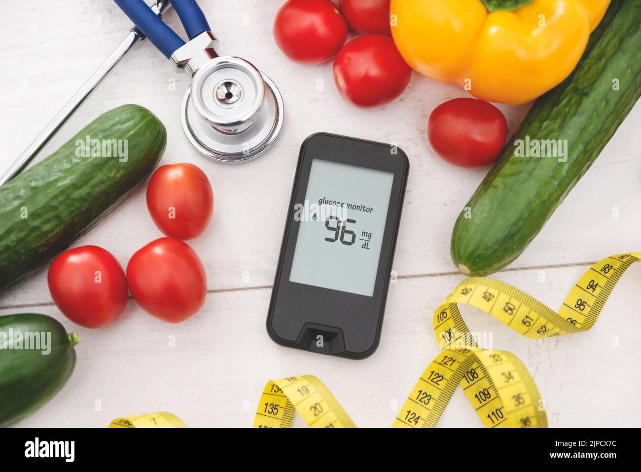 Glucometer with fresh vegetables. Healthy food, diet and nutrition ...