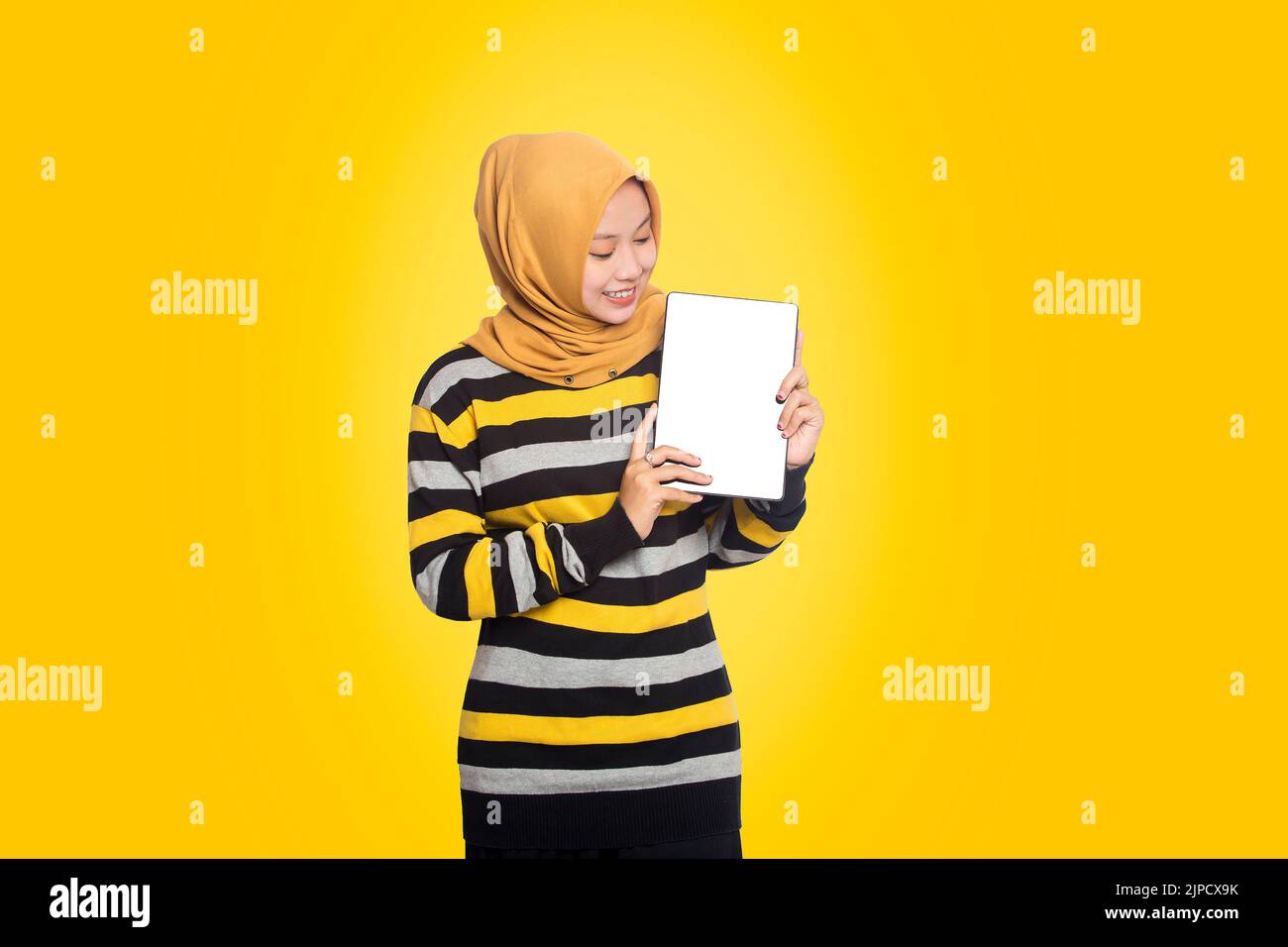 Beautiful happy Asian woman showing off digital computer tablet ...