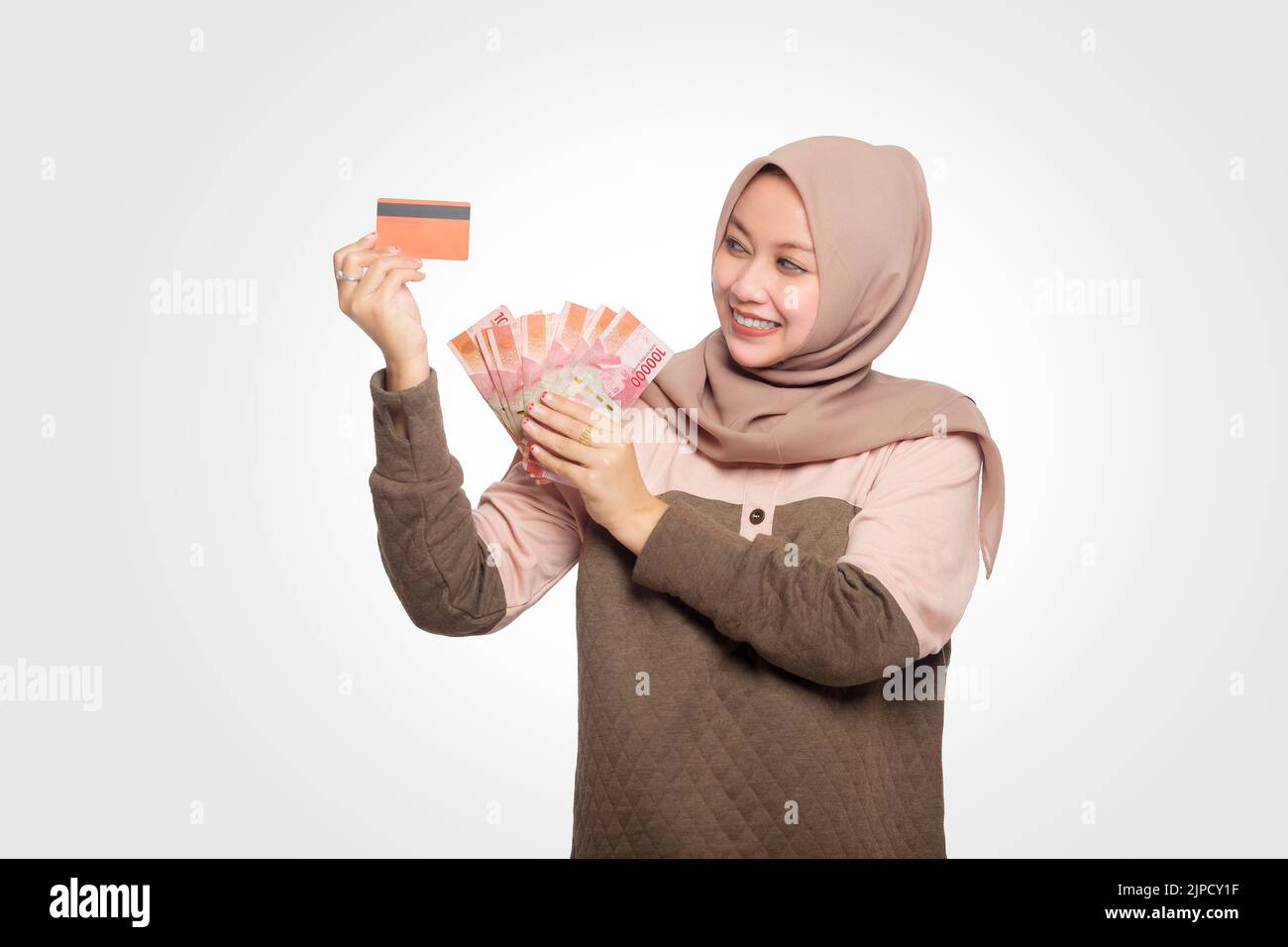 Muslim female holding business card hi-res stock photography and images ...