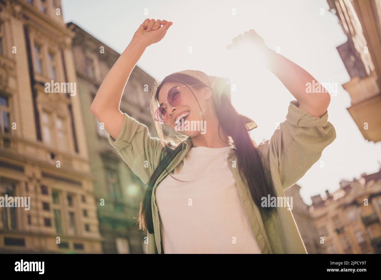 Portrait of pretty cheerful overjoyed person enjoy dancing warm sunny ...