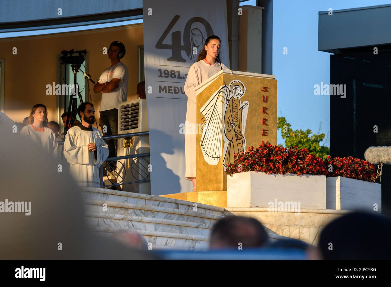 A young woman singing the responsorial psalm during the evening Holy ...