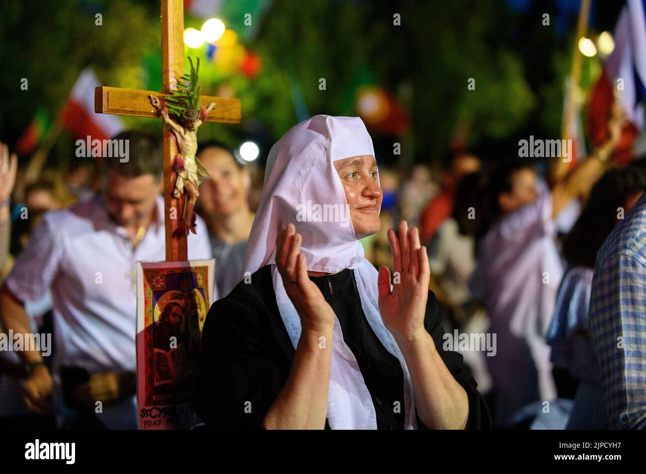 A nun, among other people, dancing and singing Christian songs during ...