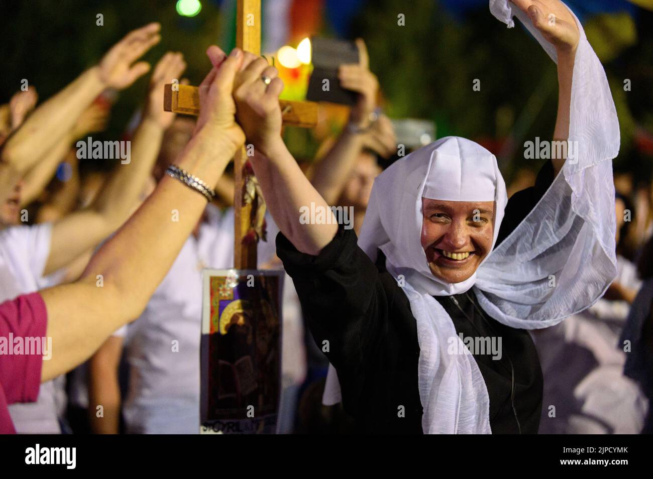 A nun, among other people, dancing and singing Christian songs during ...