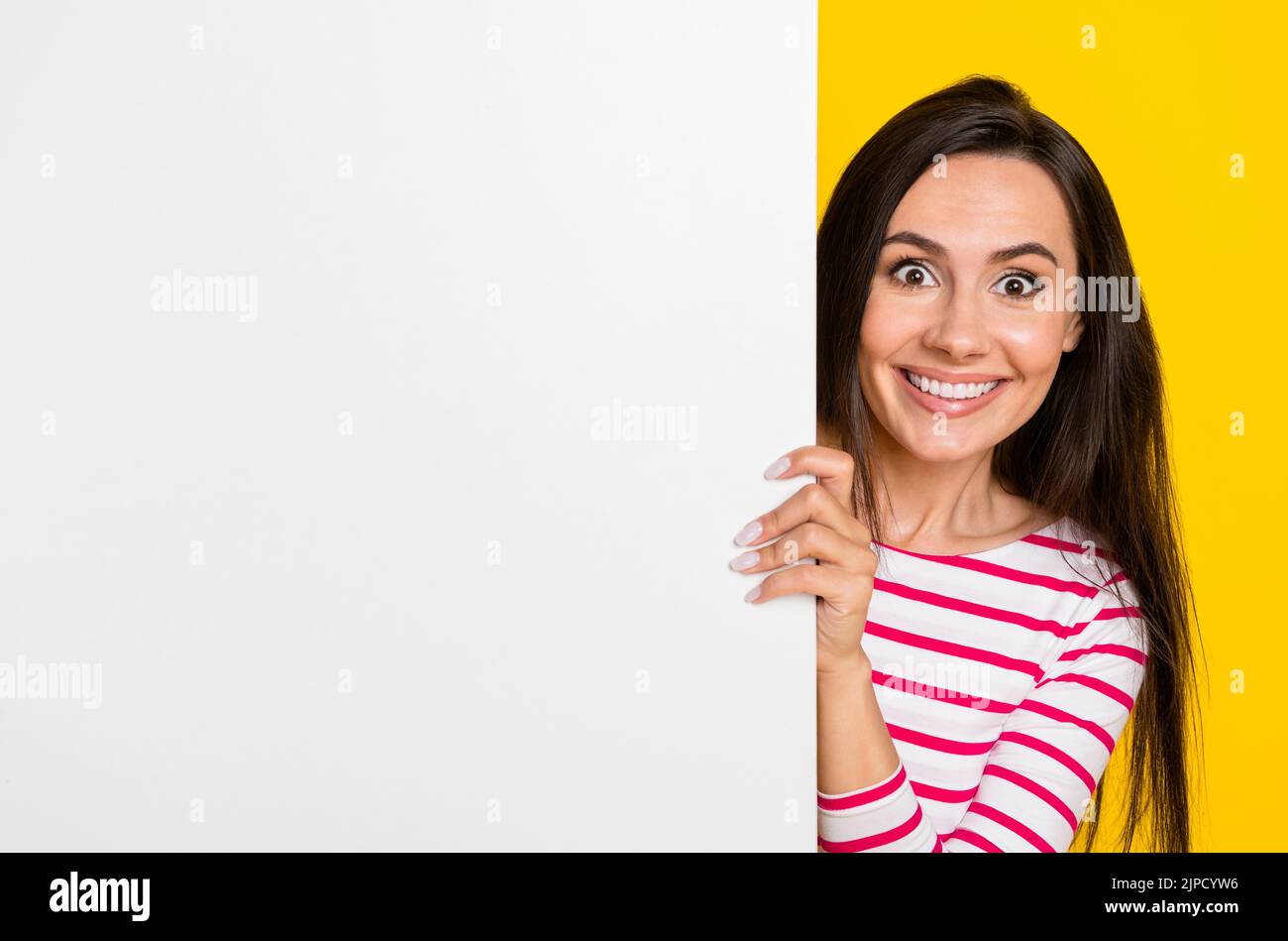 Photo portrait of charming young woman stand behind blank white empty ...