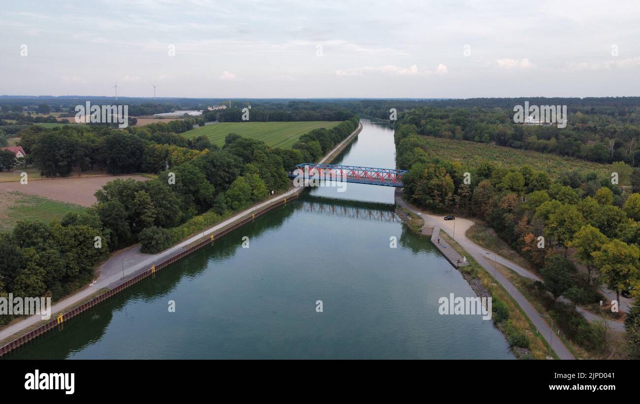 An aerial view of a bridge on a river between green banks Stock Photo ...