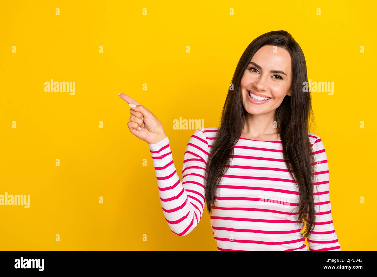 Photo portrait of stunning young woman toothy smile point offer empty ...