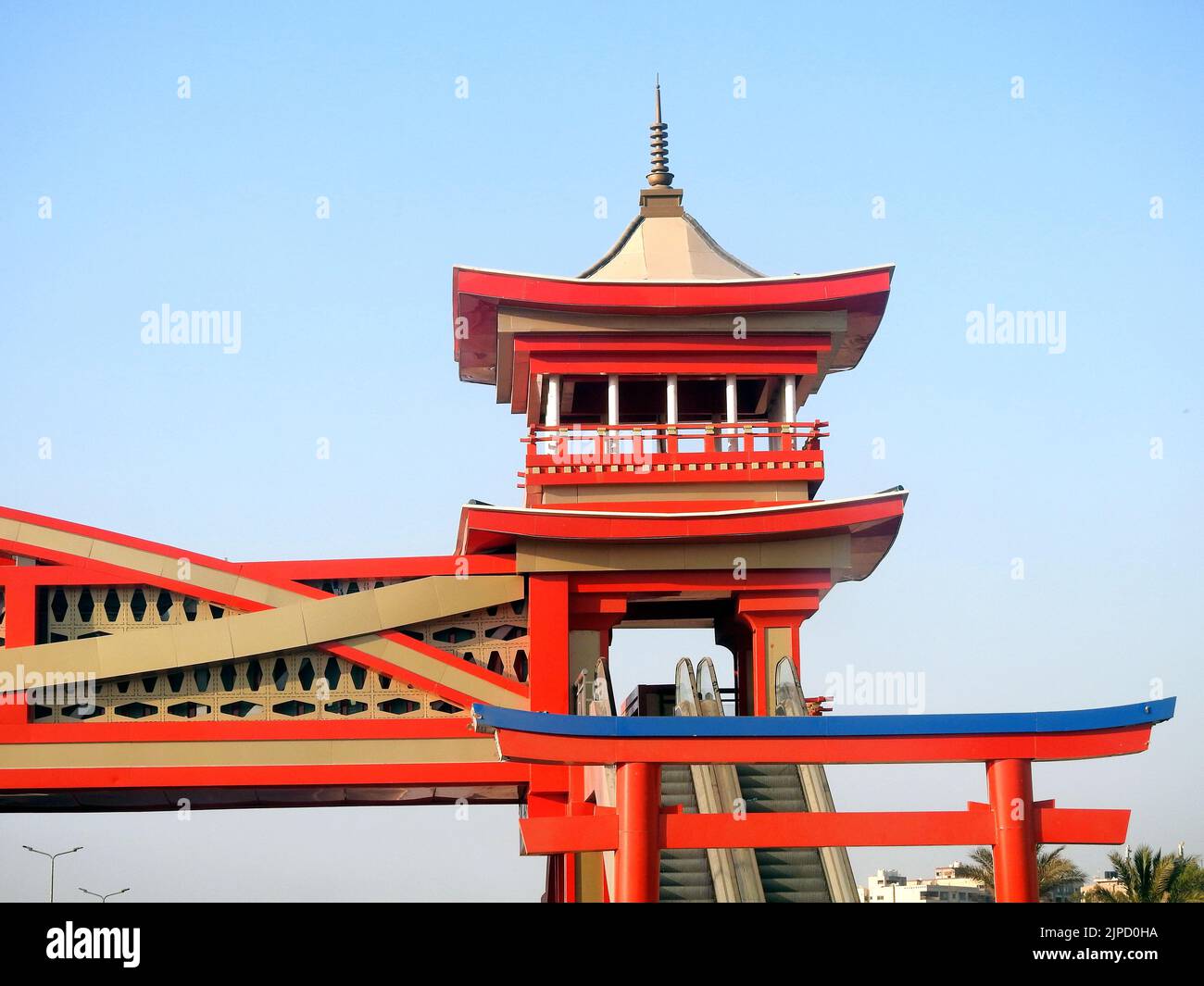 A pedestrian bridge finished in traditional Japanese architectural ...