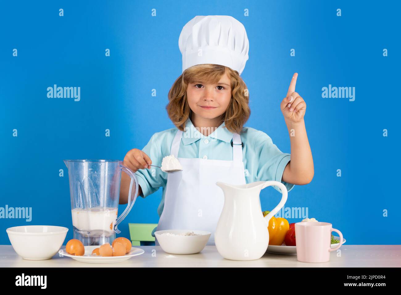 Cooking children. Chef kid boy making food with flour for healthy eat ...