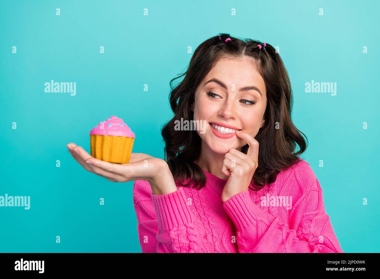 Closeup photo of young attractive cute smiling girl bite finger ...