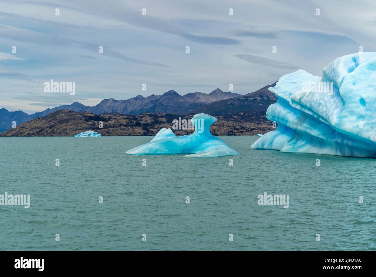 Huge ice blocks floating in the Argentino Lake under a cloudy sky Stock ...