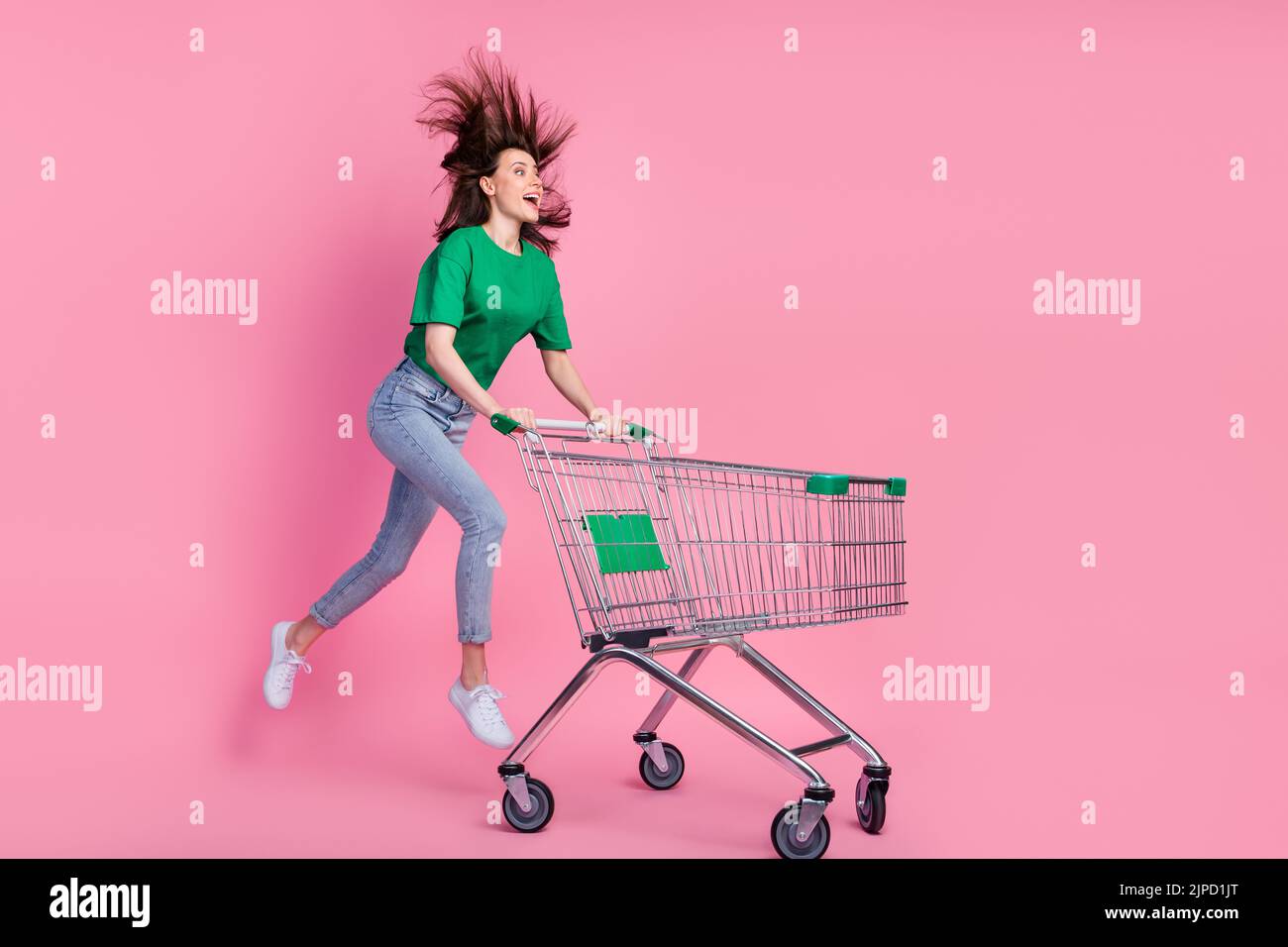Full length portrait of excited crazy person jump run push supermarket ...
