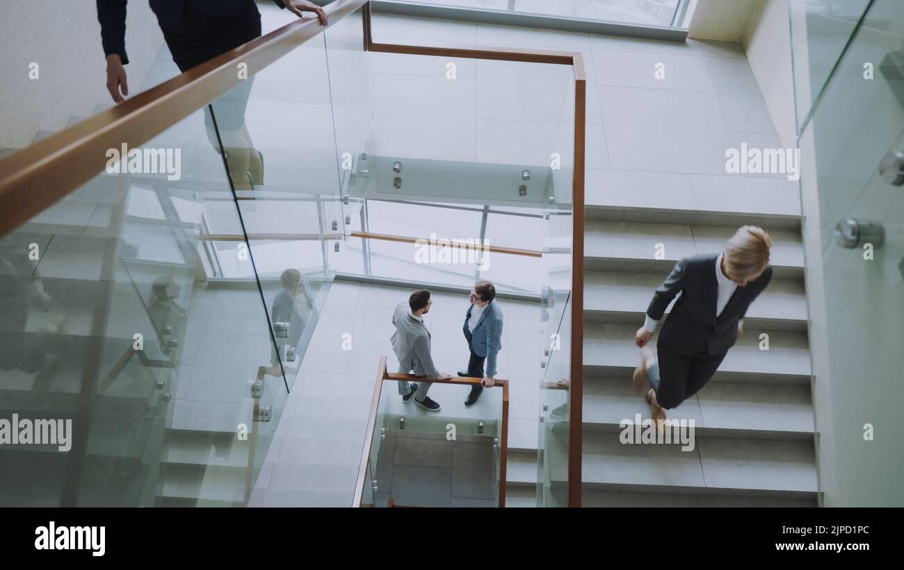 Businessman businesswoman busy staircase hi-res stock photography and ...