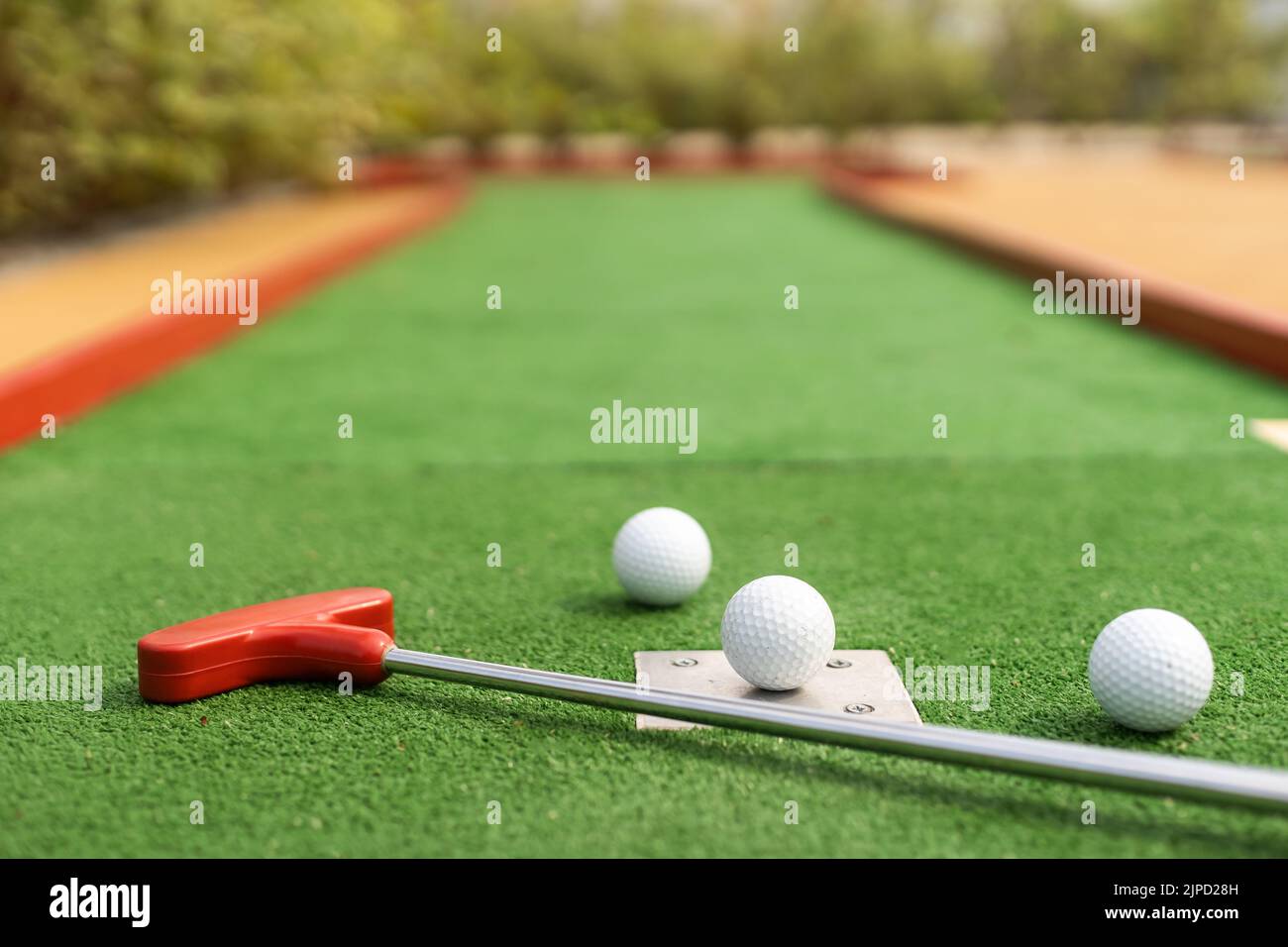 Mini-golf ball on artificial grass. Summer season game Stock Photo - Alamy