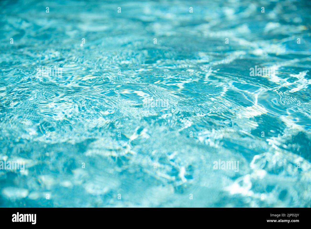 Abstract ripple wave and clear turquoise water surface in swimming pool ...