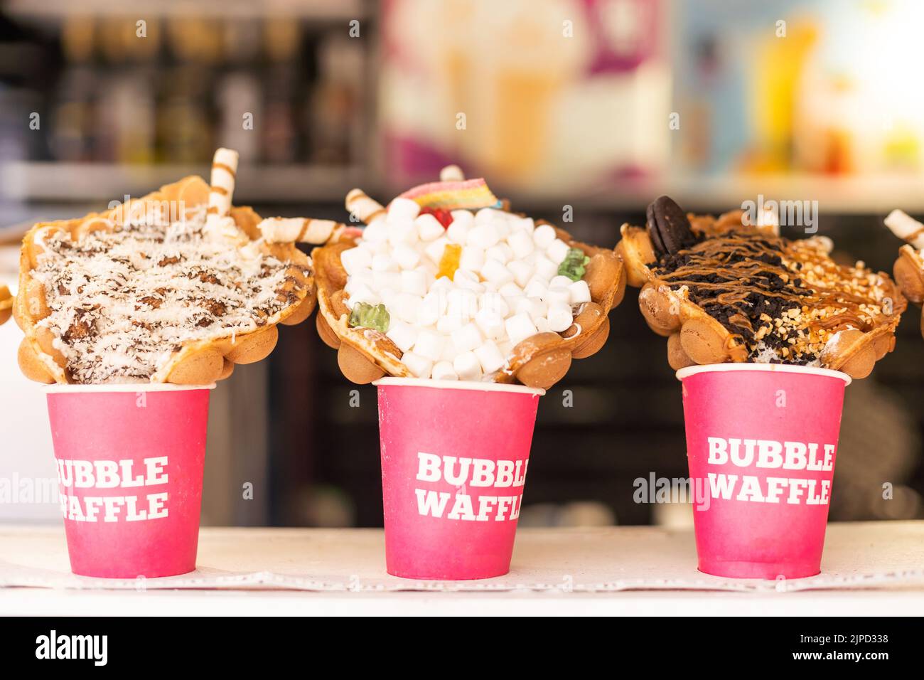 Different types of bubble waffle ice cream to go Stock Photo - Alamy