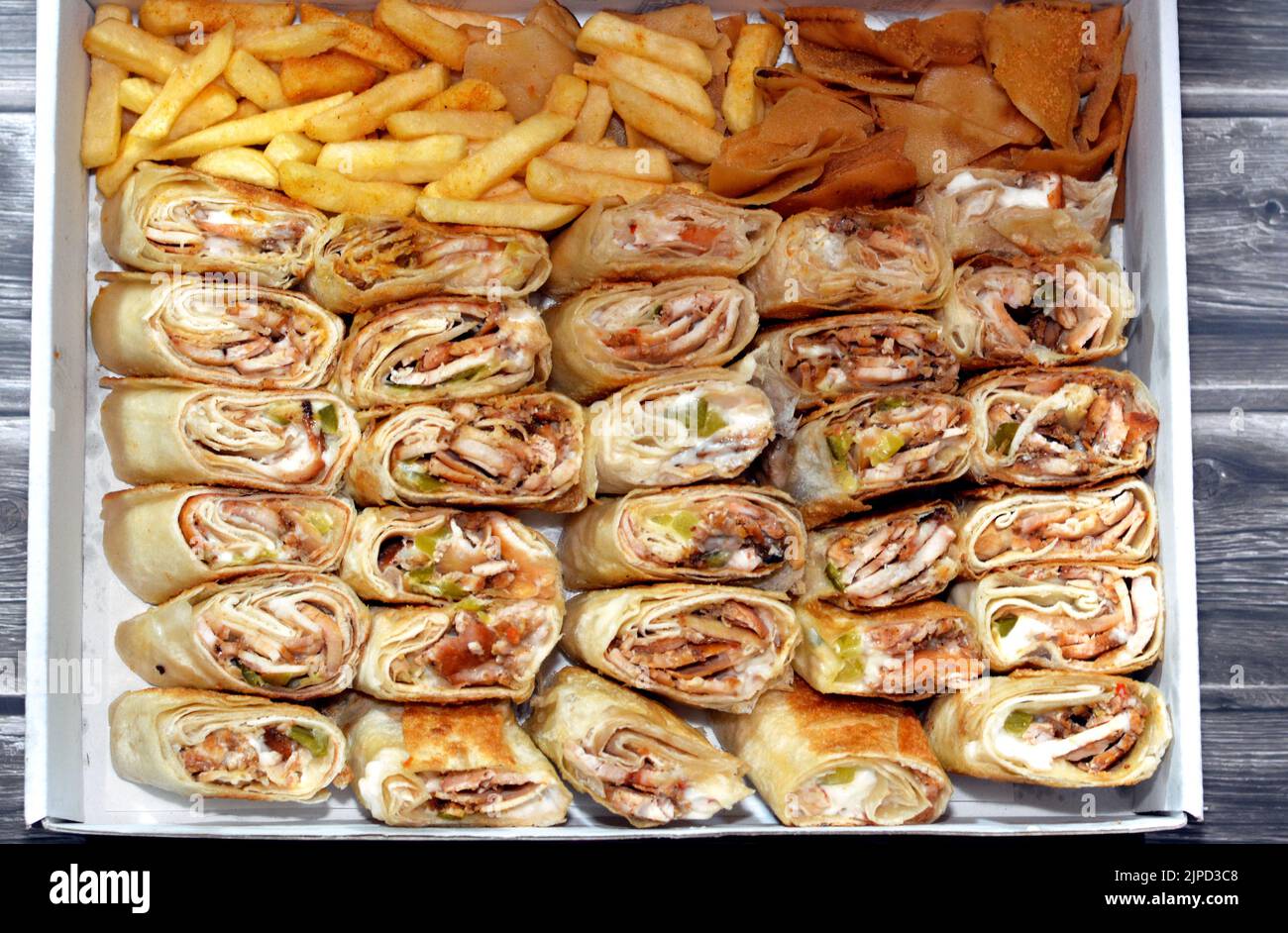 Syrian recipe cuisine background, a box full of pieces of chicken ...