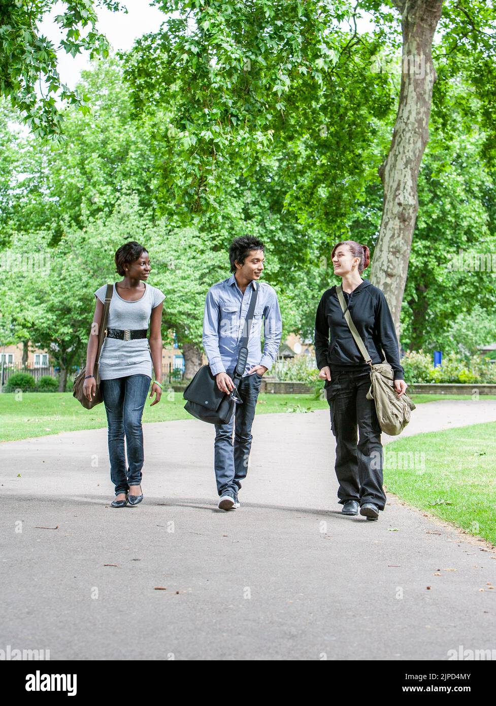 Teenage Students, discussing class. School friends walking together ...