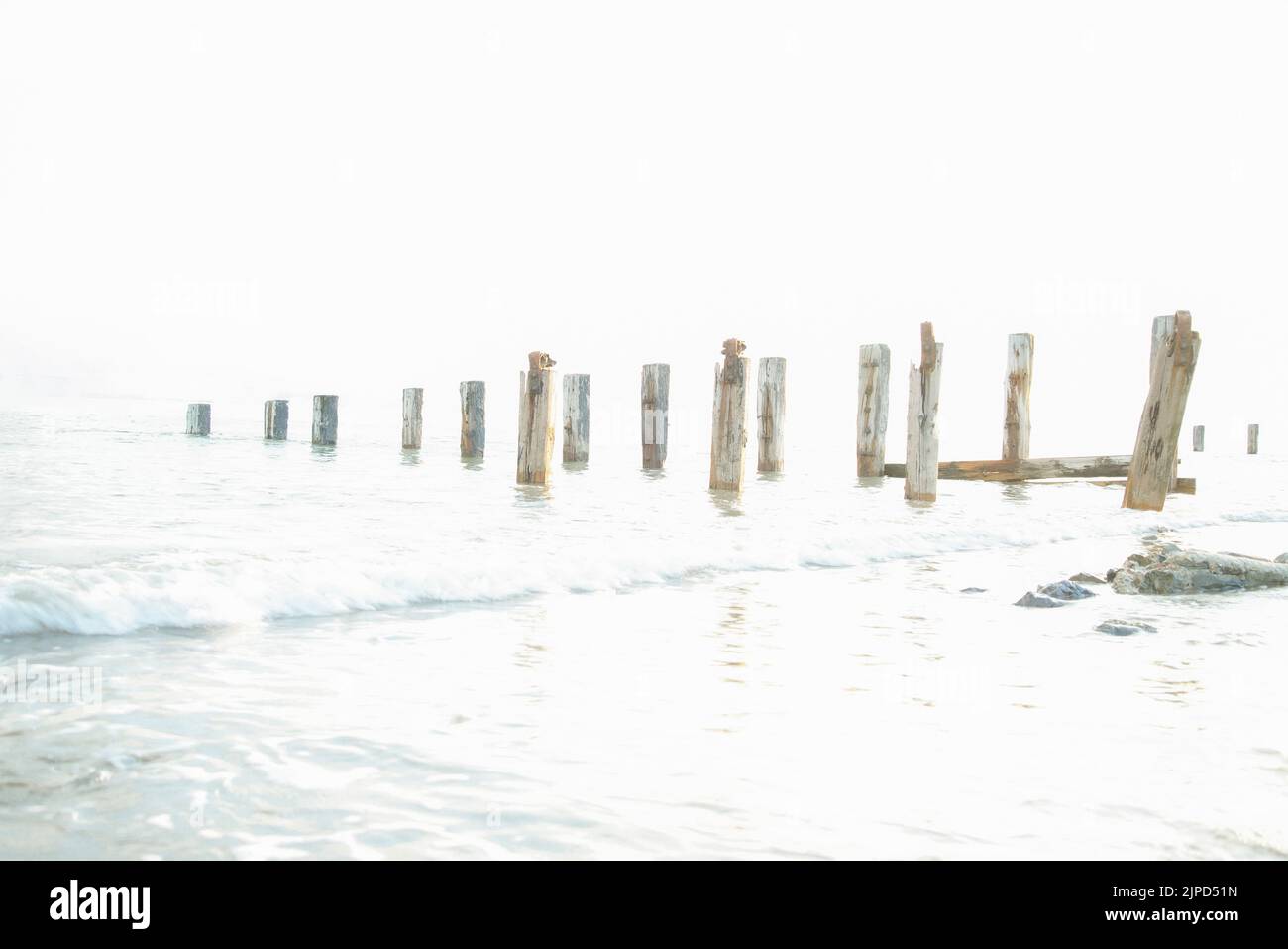 Old wooden groynes in the atlantic, at Crow Point, Devon UK Stock Photo ...