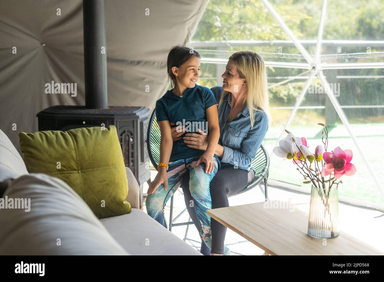 Woman mama in light clothes have fun with cute child girl. Mother and ...