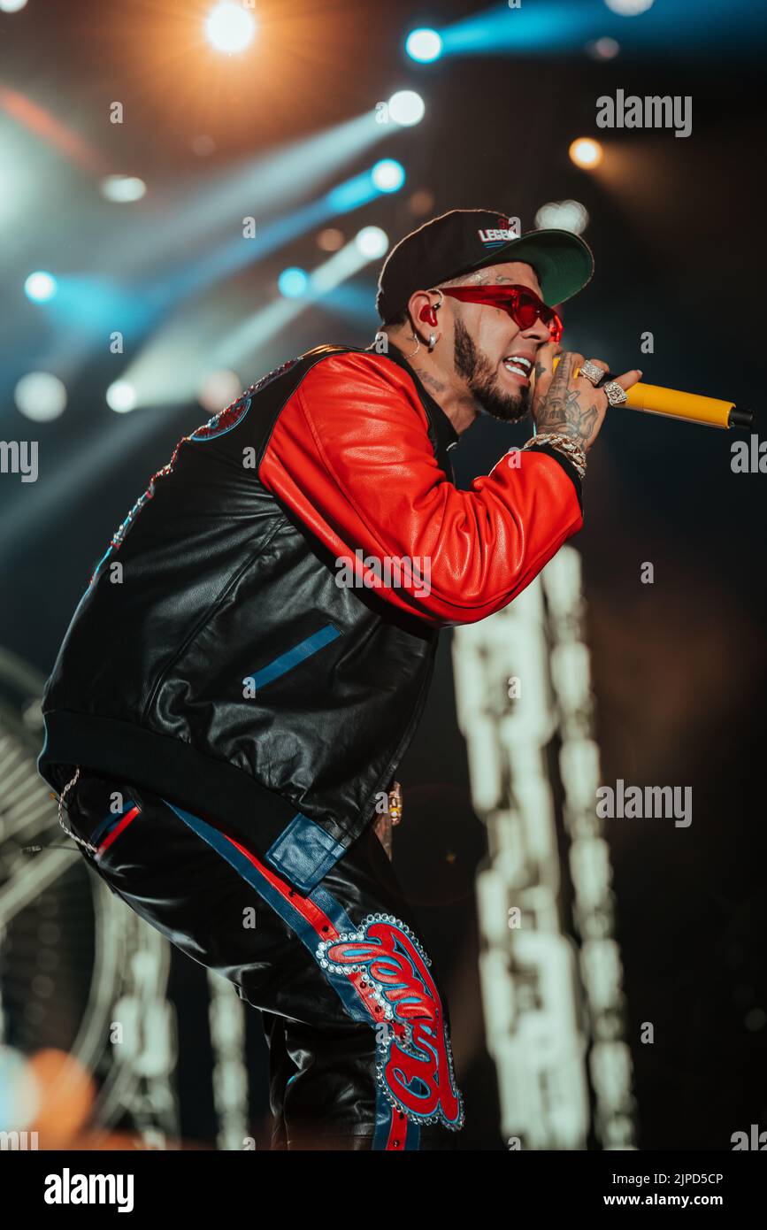 A vertical shot of rapper Anuel performing at a festival in Miami ...