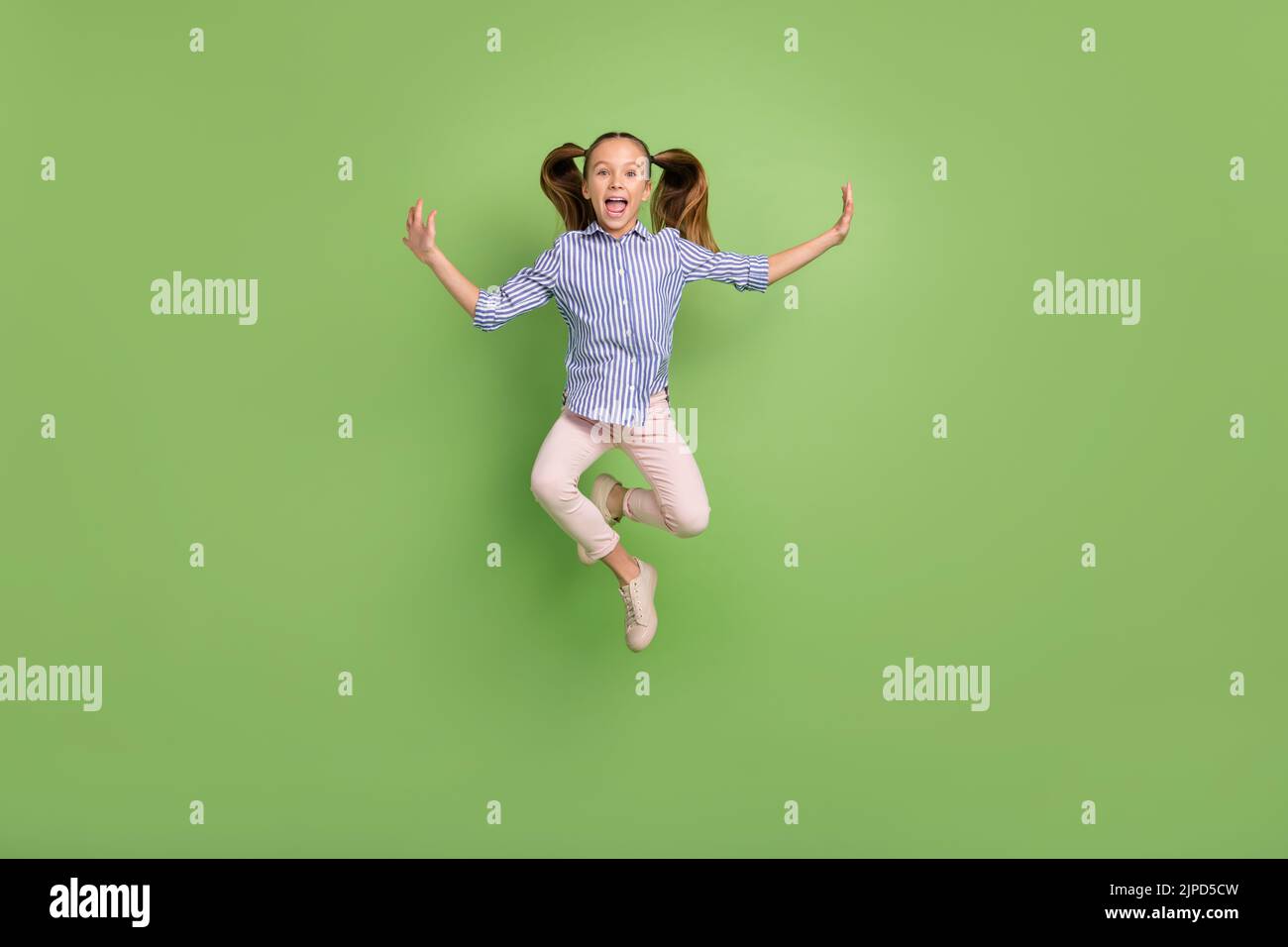 Full size photo of excited kid girl jump high travelling wear striped ...