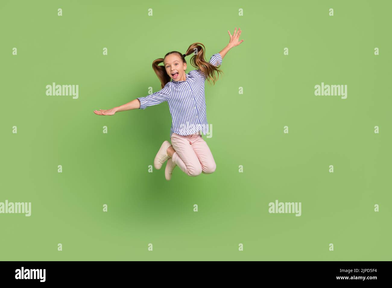 Full size photo of carefree child girl jump high fly like airplane wear ...