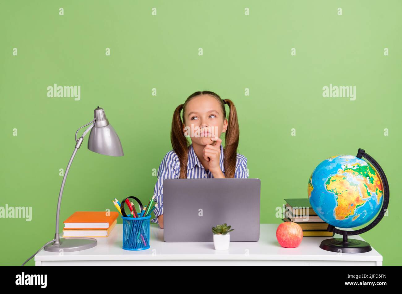 Photo of suspicious little schoolkid wear striped shirt ponytails ...