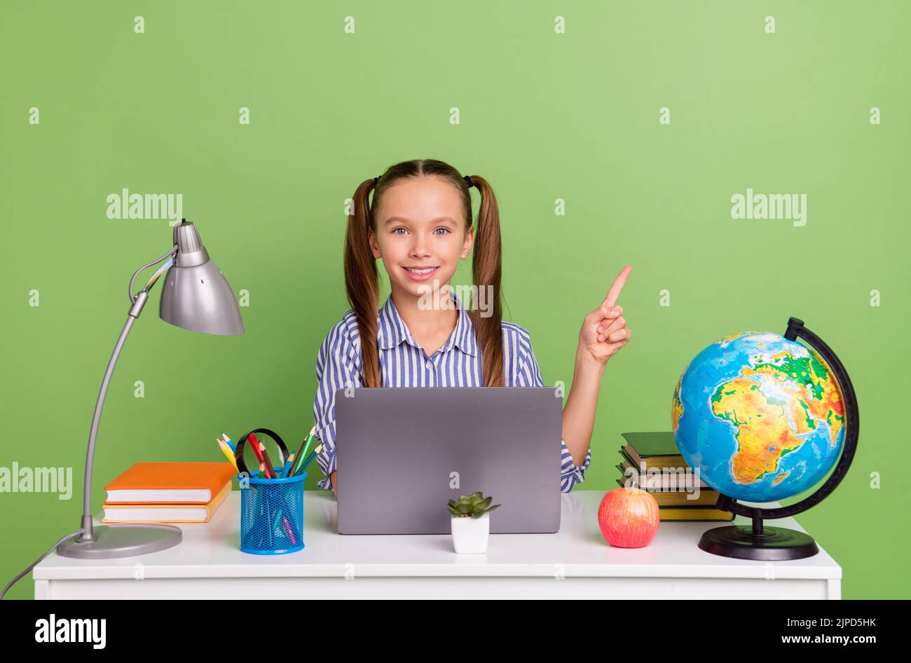 Photo of cute funny small schoolkid dressed striped uniform tails ...