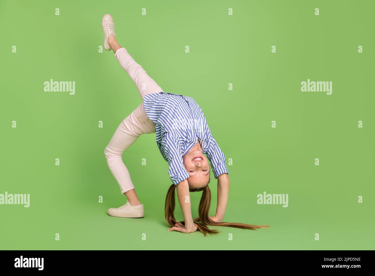 Photo of energetic kid child make bridge pose dancing element wear ...