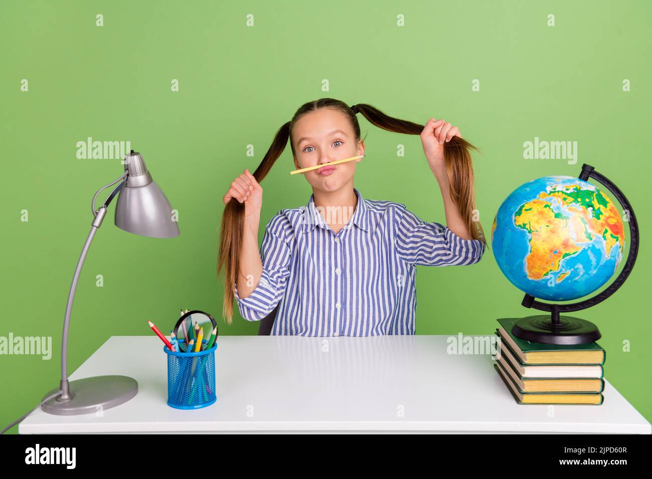 Photo of pretty funky small schoolkid dressed striped uniform tails ...