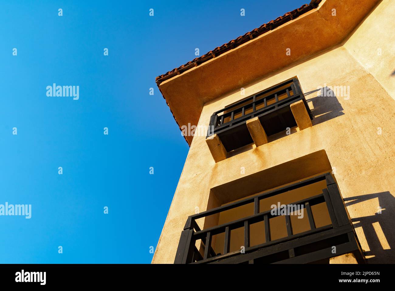 Beautiful hotel building with small balconies on it Stock Photo - Alamy