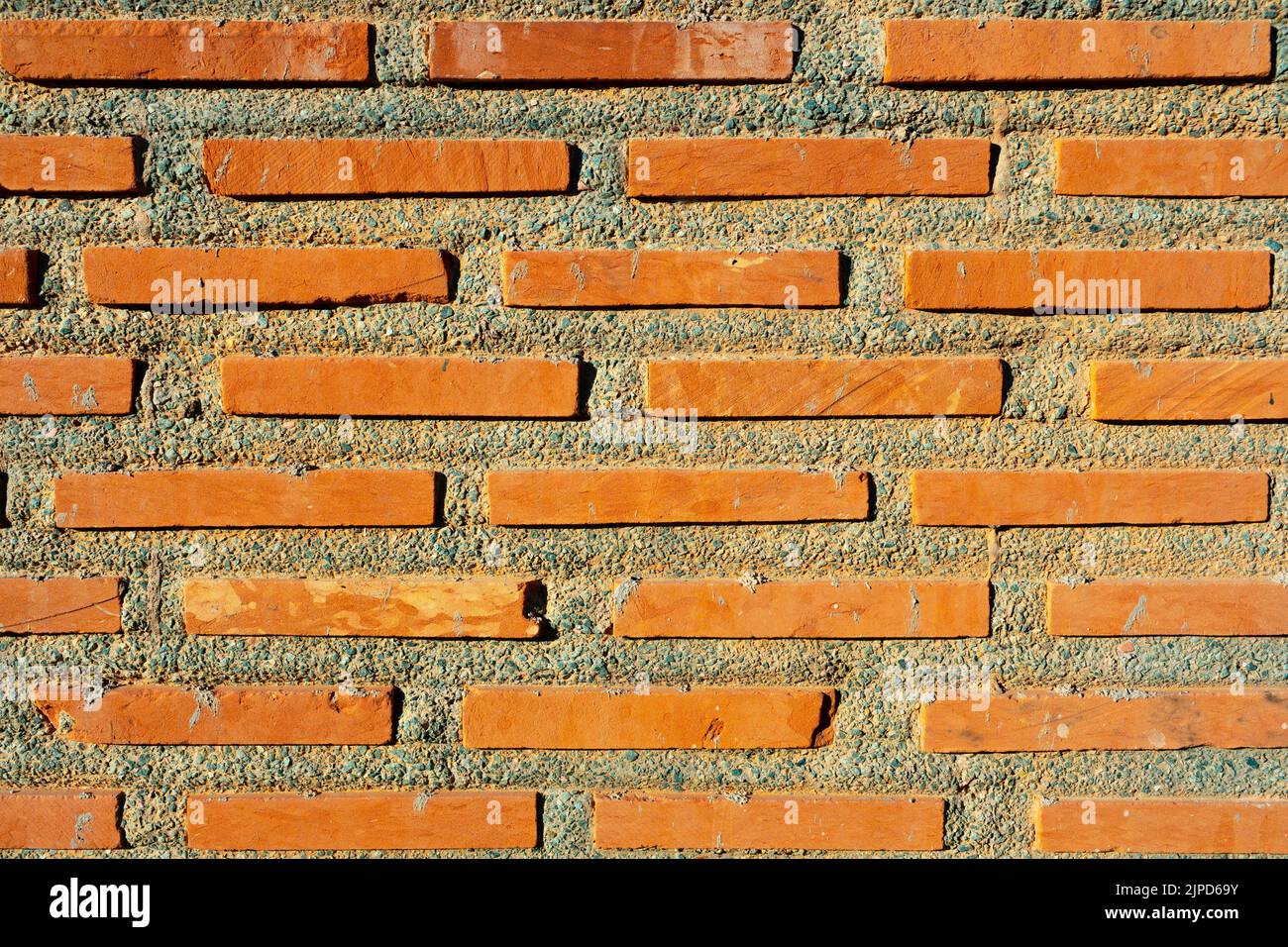 Outdoor brick wall made from narrow long bricks Stock Photo - Alamy