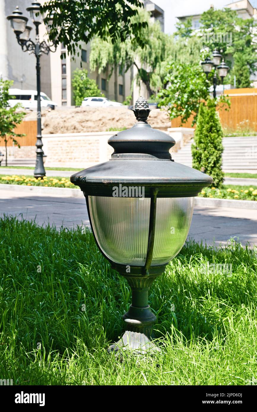Outdoor electric street lamp on the lawn for city lighting in the ...