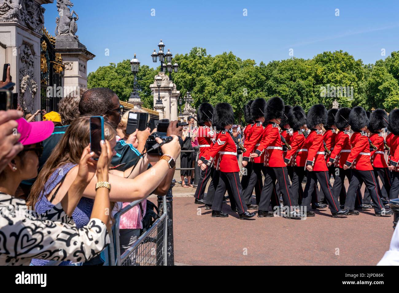 Guards March Out Of Buckingham Palace During The Changing Of The Guard ...