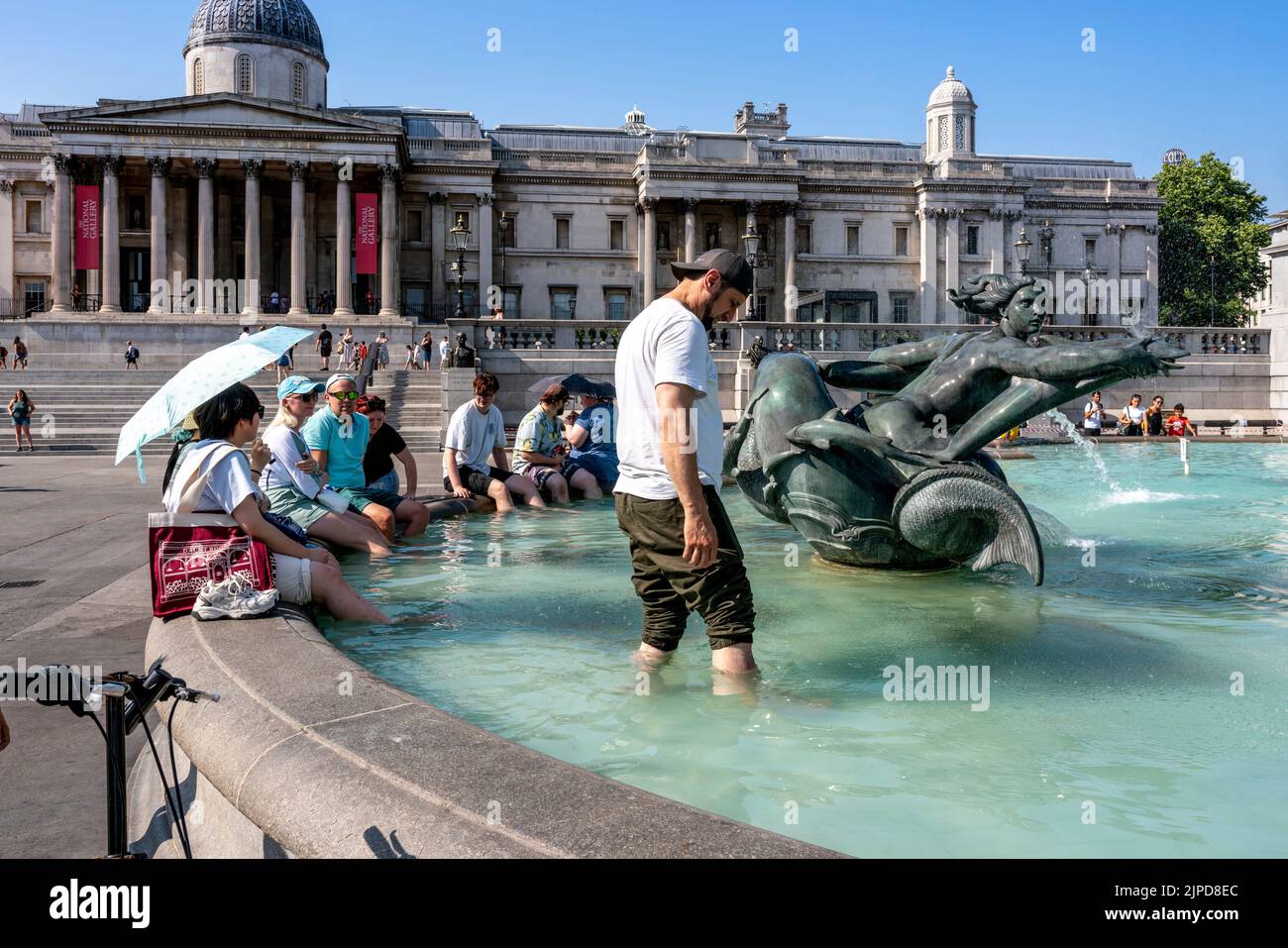 People Cool Off In The Fountains In Trafalgar Square During The Hottest ...